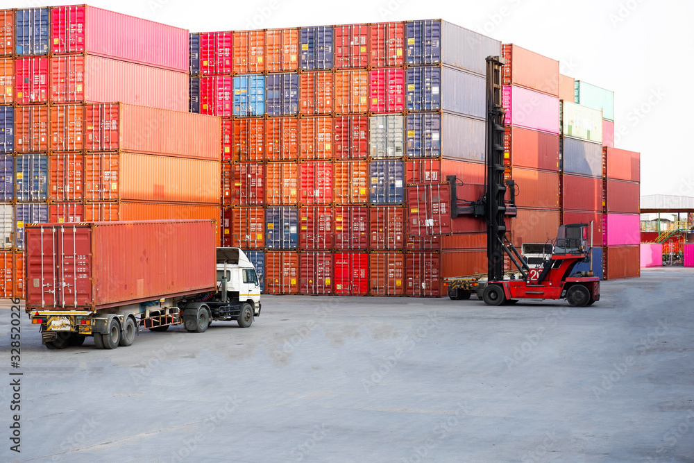 Container handlers and trucks In the loading and unloading yard Stock ...