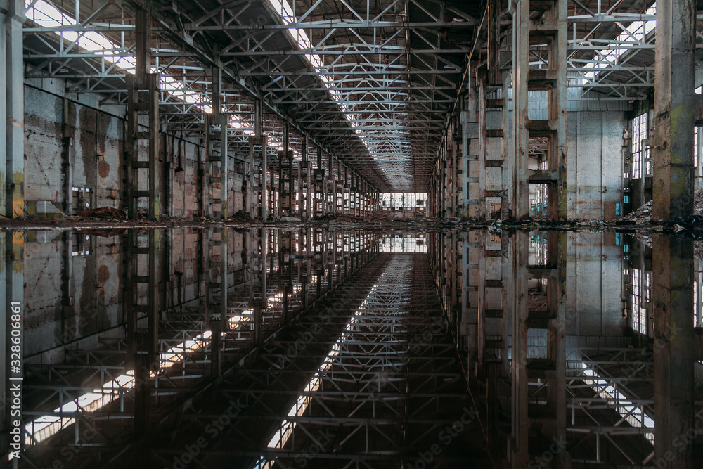 Inside of flooded dirty abandoned ruined industrial building with water ...