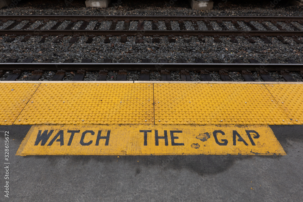sign at the railroad station at the edge of the platform looking toward ...