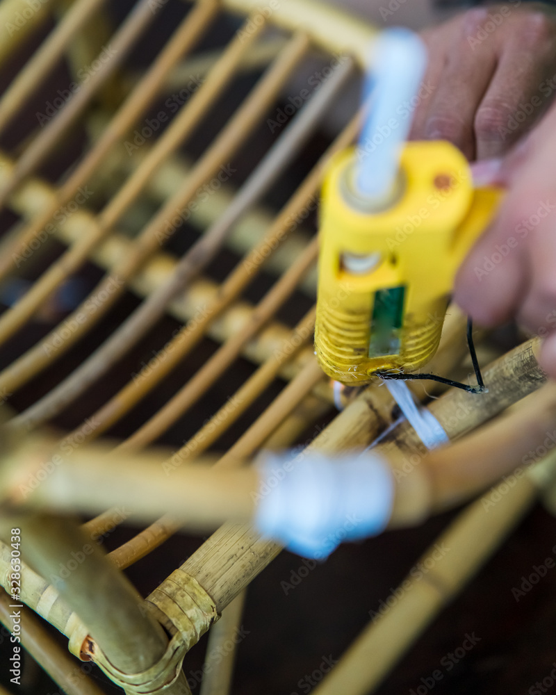 Restoration of rattan chair with white thread. Recycling, upcycling and ...