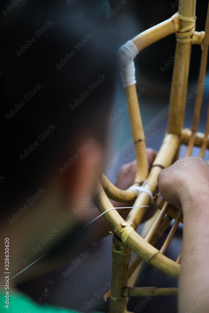 Restoration of rattan chair with white thread. Recycling, upcycling and ...