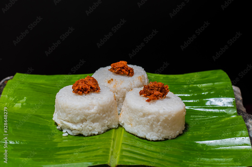 The milk rice on a banana leaf. Milk rice is a traditional Sri Lankan ...