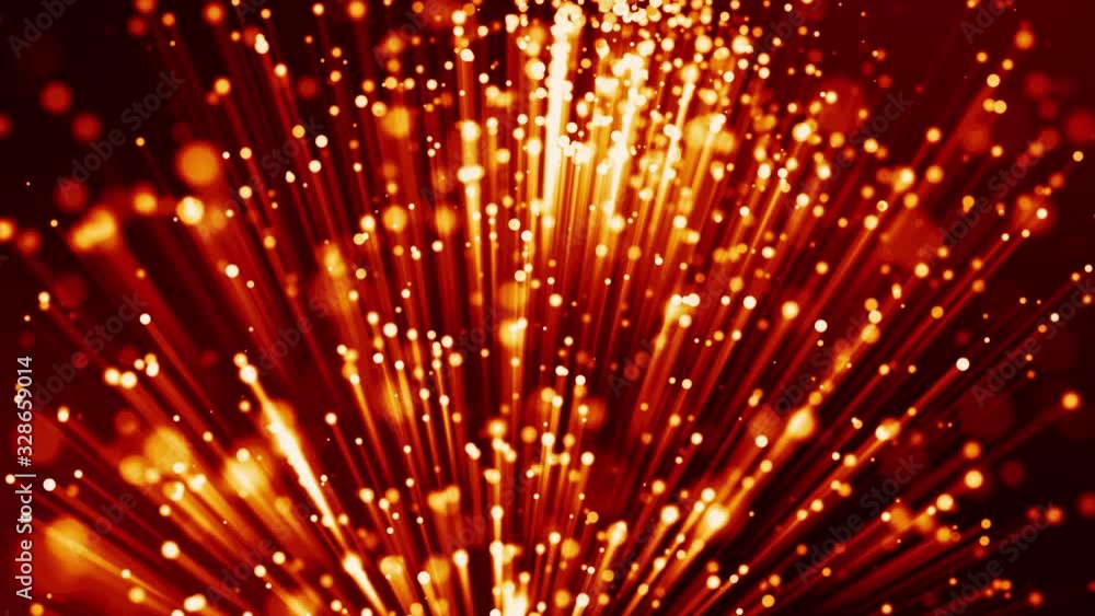 red yellow particles float in liquid and glisten with light rays ...