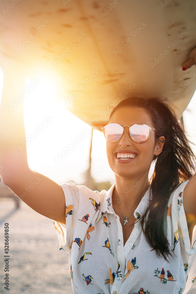 Portrait of a Pretty smiling Surf brunette woman with long hair and ...