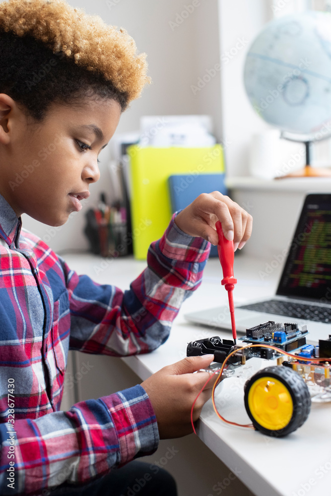 Male Elementary School Pupil Building Robot Car In Science Lesson Stock ...