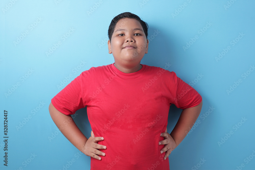 Funny cute Asian fat boy shows his big belly Stock Photo | Adobe Stock