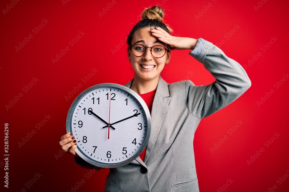 Beautiful blonde woman with blue eyes wearing glasses doing countdown ...