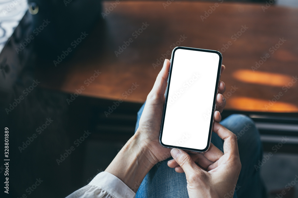 Mockup image blank white screen cell phone.woman hand holding texting ...