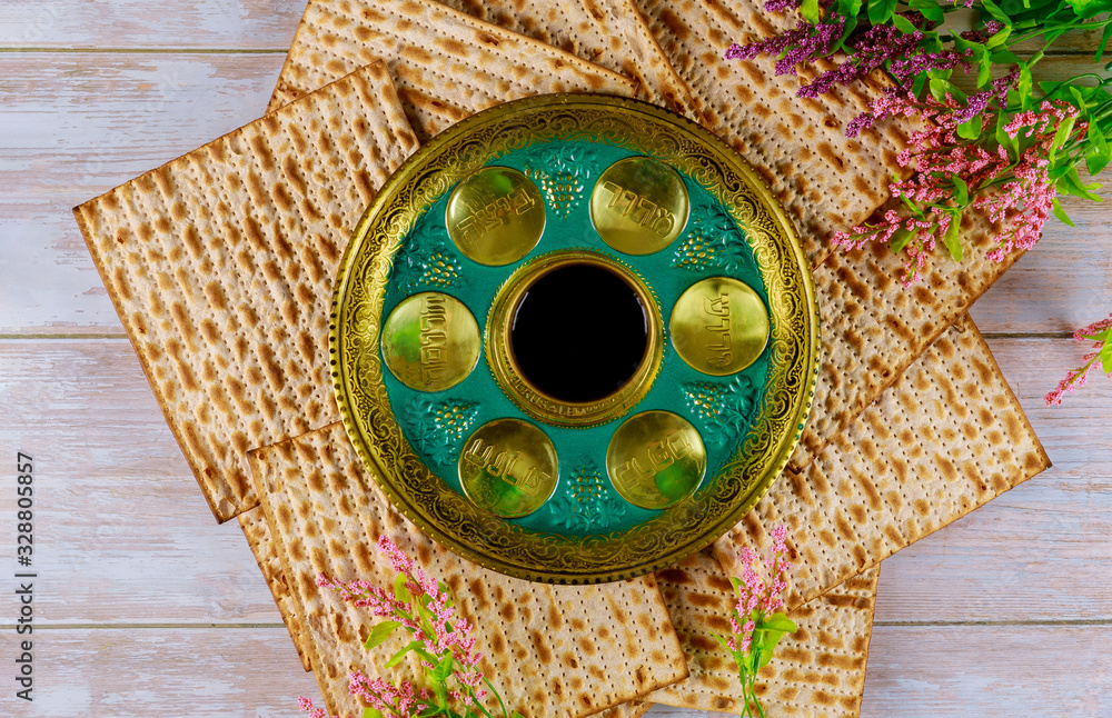 Jewish matzah, kiddush and seder with text in hebrew egg, bone, herbs ...