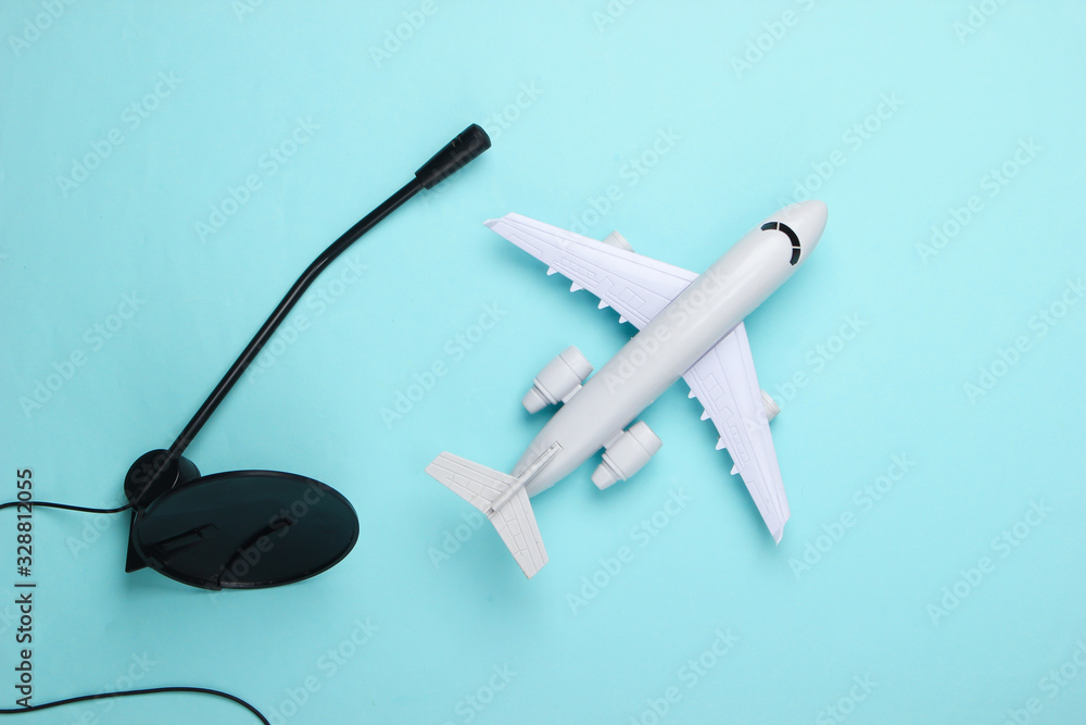 Air traffic controller, flight dispatcher. Plane figurine, microphone ...