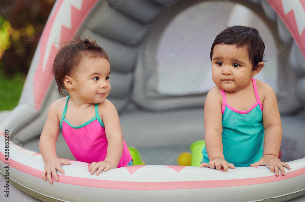 Happy kids in inflatable pool Stock Photo | Adobe Stock