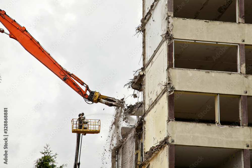 crane lift works on demolition of brutal reinforced concrete plate ...