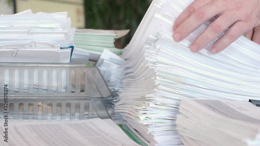 Person take a stack of sheets from the desk at the office. Stock ビデオ ...