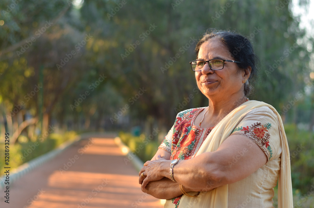 Fotka „Smart and confident senior north Indian woman standing, posing ...