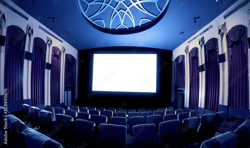 Cinema theater screen in front of seat rows in movie theater showing ...