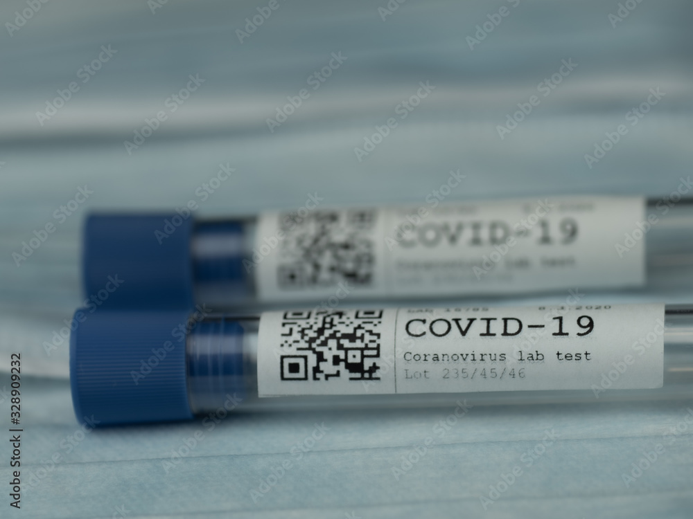 Test tube sample COVID-19 test on background from face masks Stock ...