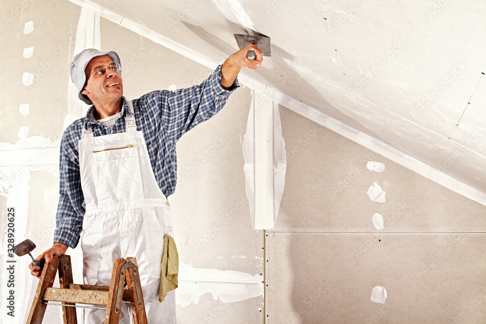 Drywall installation, filling the joints of plaster boards Stock Photo ...