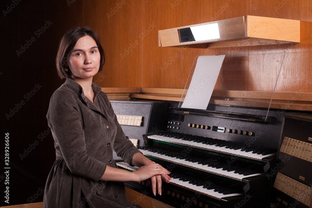 Organist playing a pipe organ, closeup view Stock Photo | Adobe Stock