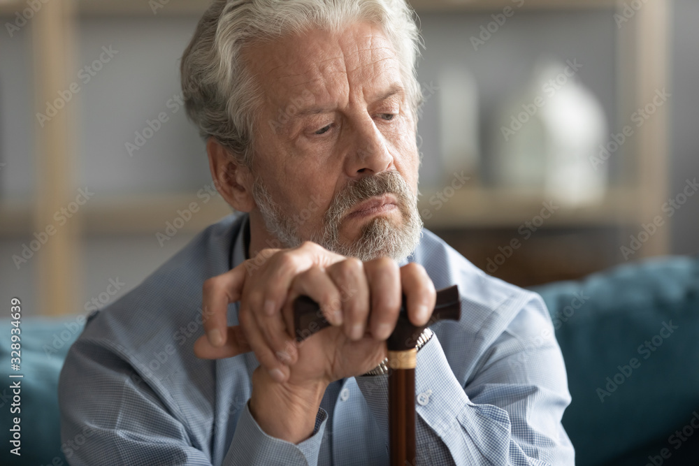 Pensive old man with walking stick look in distance thinking pondering ...