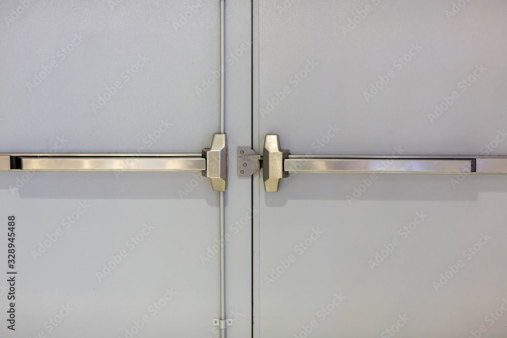 Emergency fire exit door. Closed up latch and rusty door handle of ...