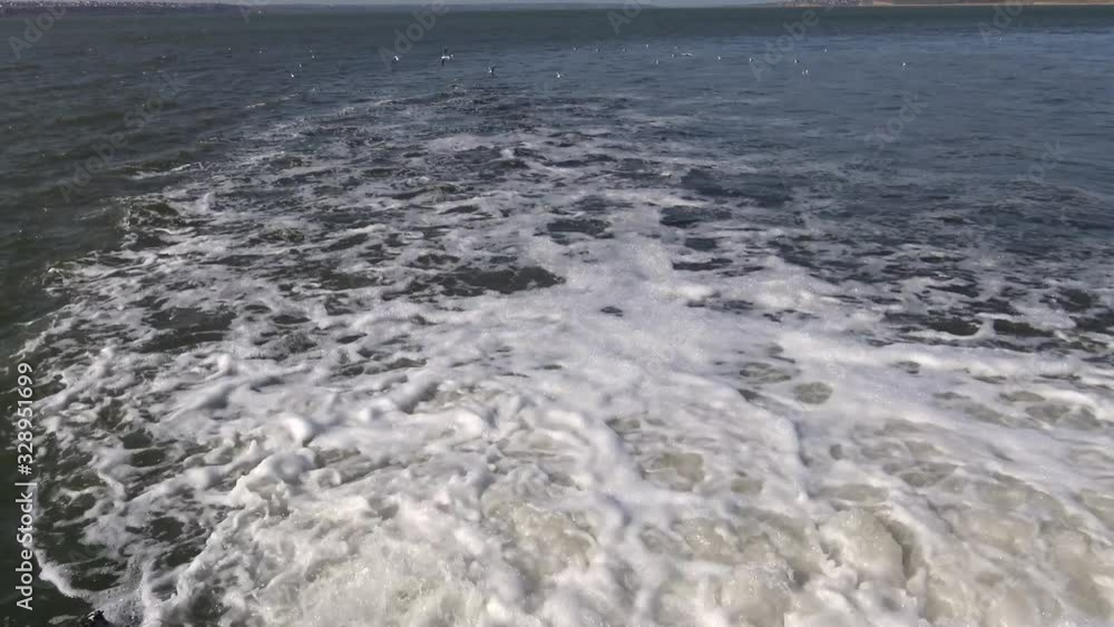 Water pollution. Dirty water from treatment plants flows through a pipe ...