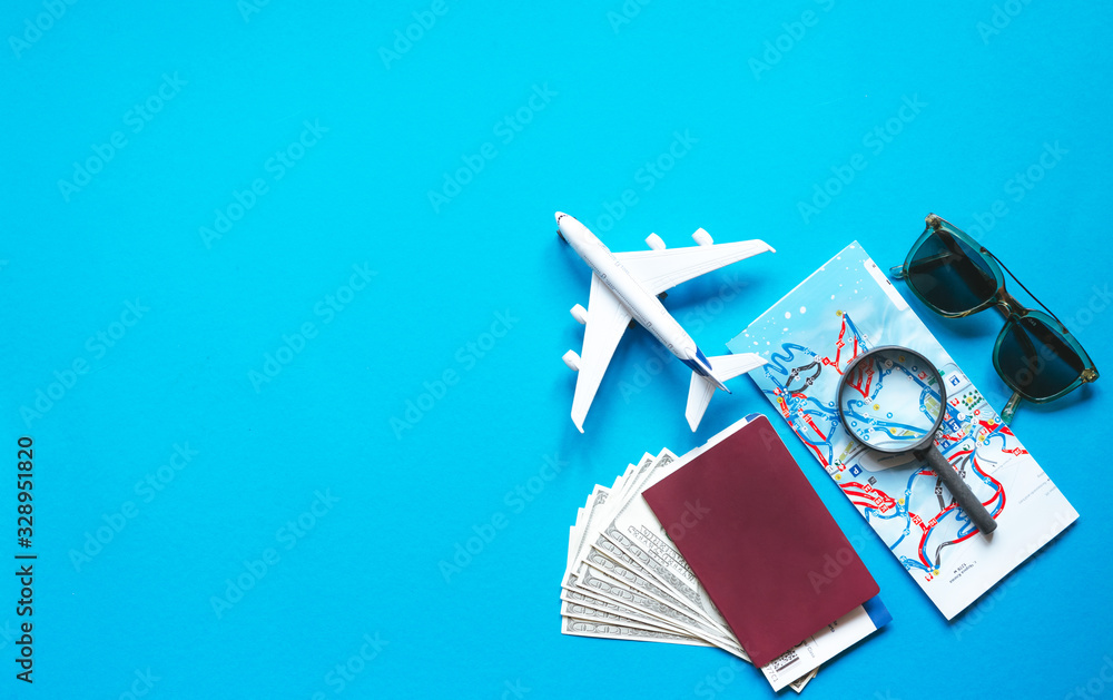 Travel accessories and objects on a blue background with a top view and ...