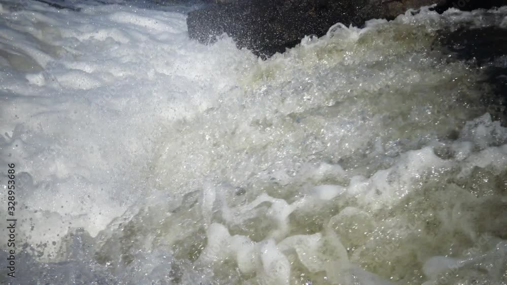 Water pollution. Dirty water from treatment plants flows through a pipe ...