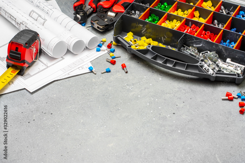 Crimping tools and boxes with tips of various sizes and colors for ...