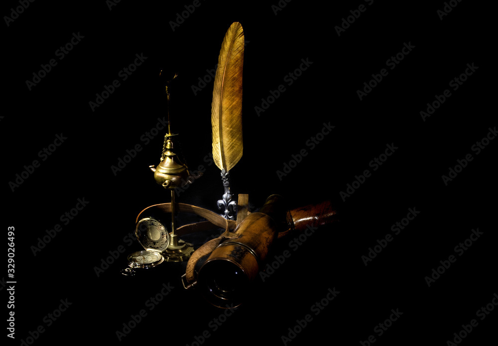 Retro items on black background. Antique lamp, clock and feather. Low ...