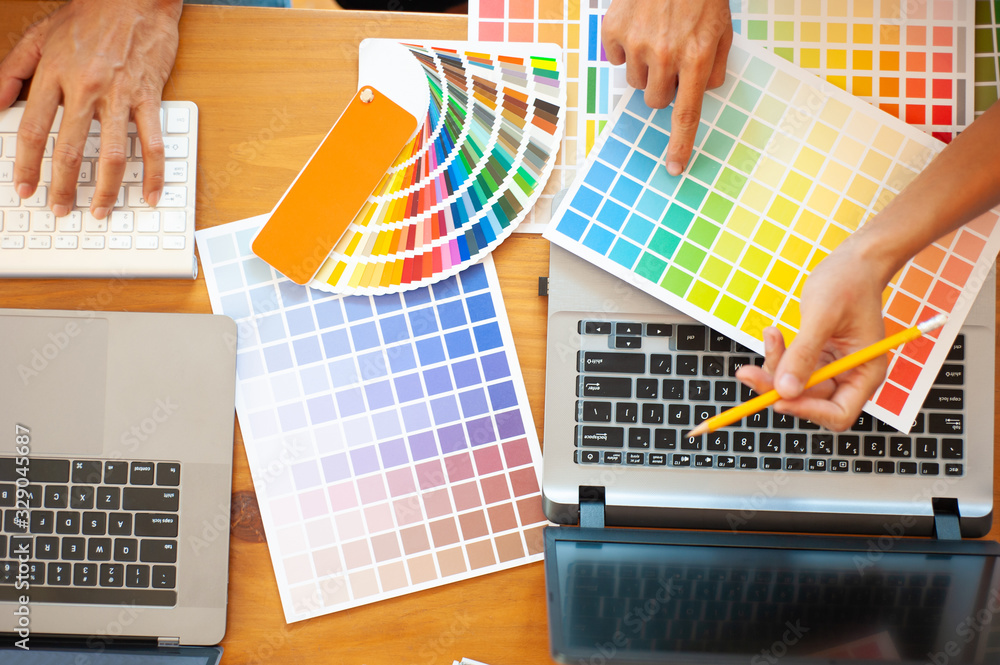 The graphic designer selects the color for the design of his work ...