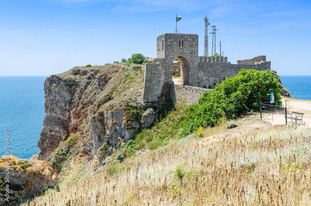 Partially reconstructed tower and walls of a medieval fortress on the ...