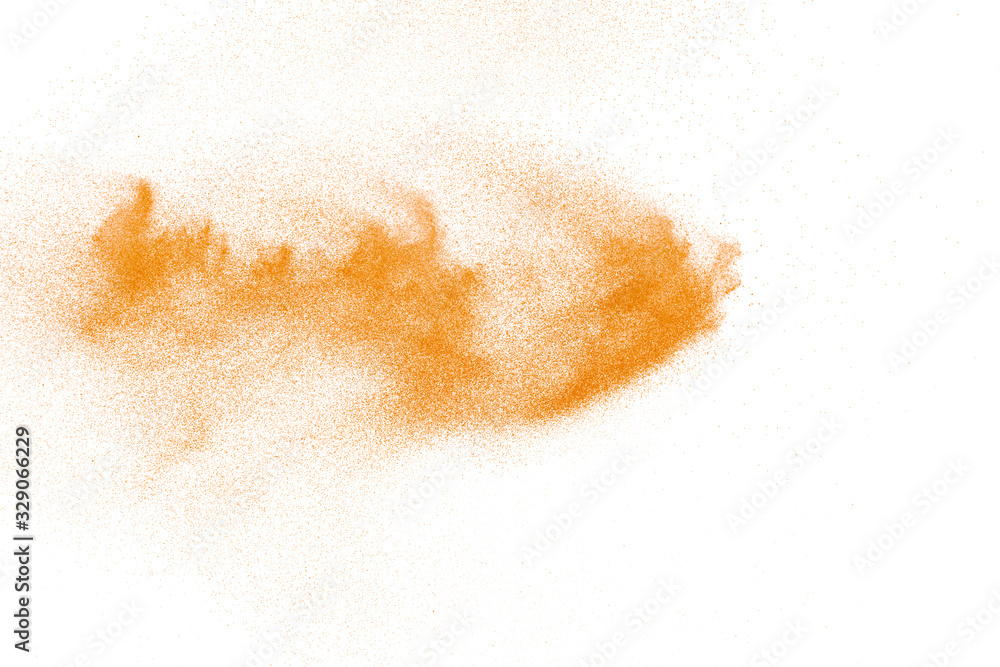 Orange powder dust particles explosion on white background.Orange dust ...