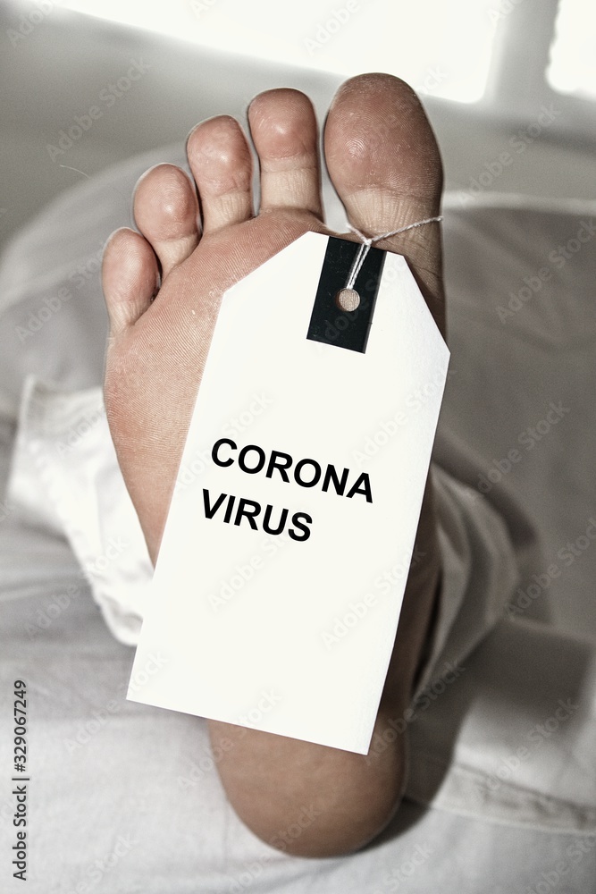 Dead body in morgue with identification sign on thumb. This person has ...