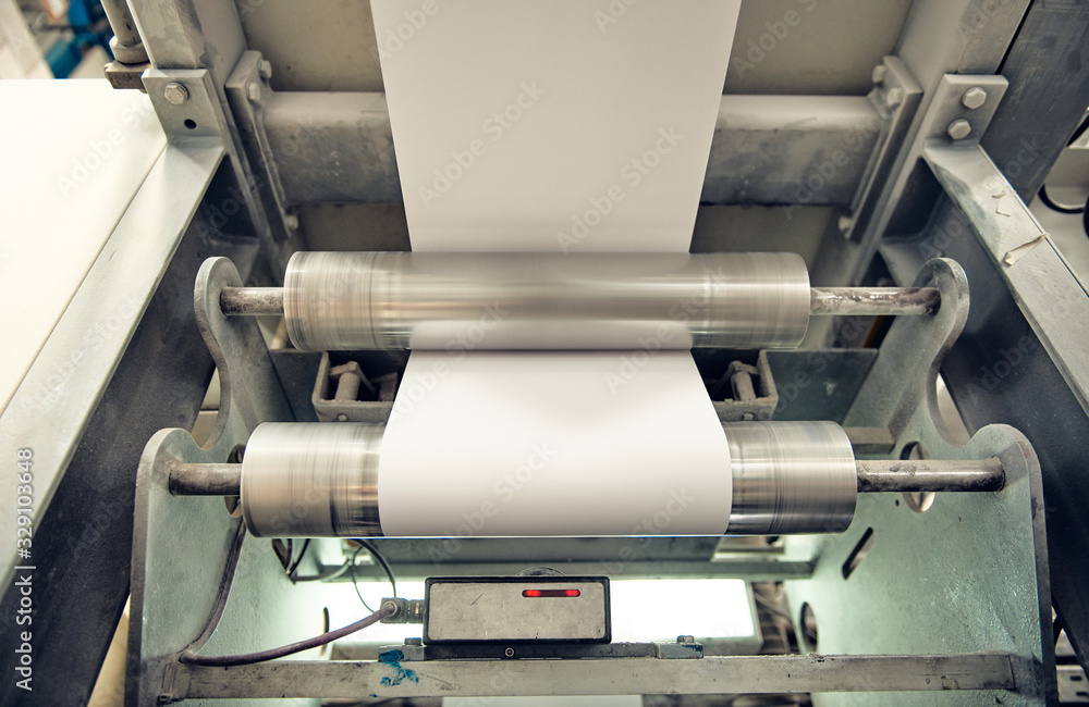 A industrial commercial envelope making machine, making paper envelopes ...