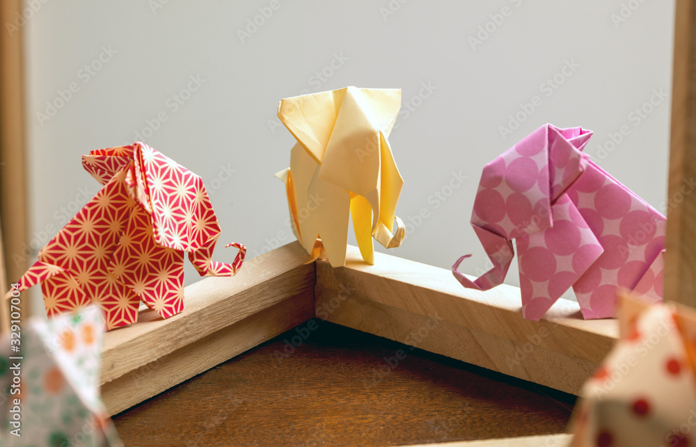 Origami is the art of paper folding, which is often associated with ...