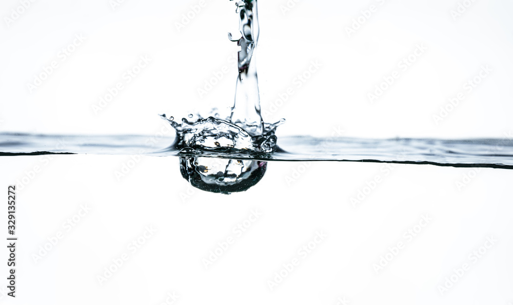 Pouring water splash on water surface on white background, isolated ...