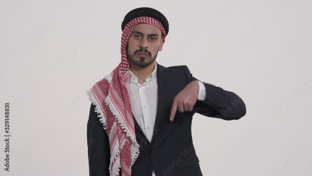 Disappointed Arab man in ethnic Saudi kufiya expressing negative ...
