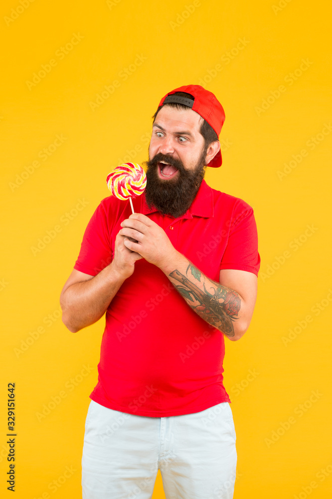 Who cares about diet. Bearded man with lollipop. candy shop assistant ...