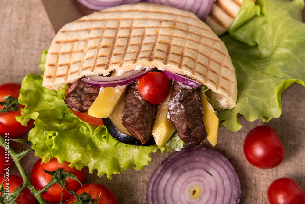 Pita doner kebab with green salad, potato free, tomatoes, cherry ...