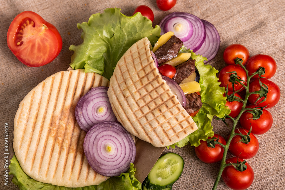 Pita doner kebab with green salad, potato free, tomatoes, cherry ...