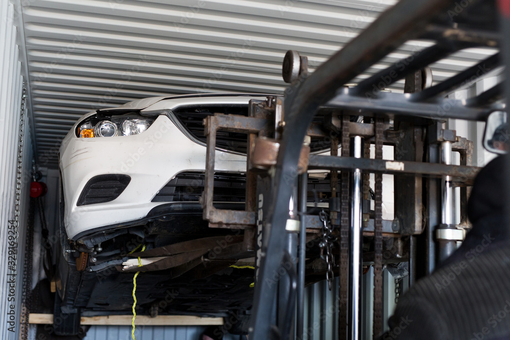 Unloading the car from the container Stock Photo | Adobe Stock