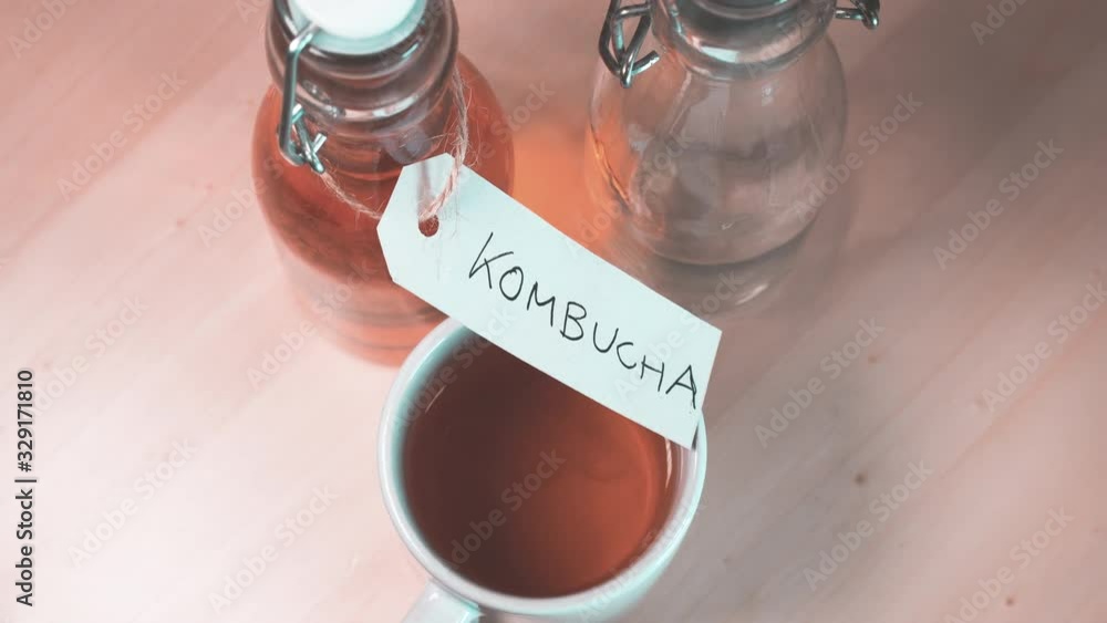 Vídeo do Stock: Handwritten label on a bottle of homemade Kombucha. It ...