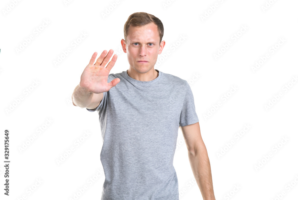 Caution! A young man extended his hand forward in front of him, gesture ...