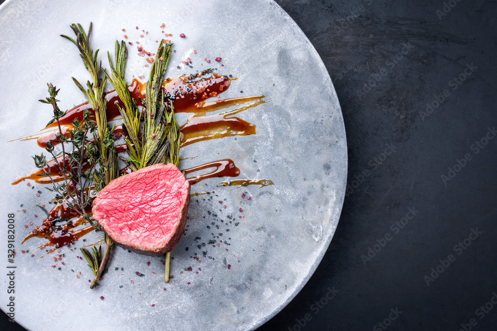 Barbecue dry aged beef fillet medallion steak natural with fried herbs ...