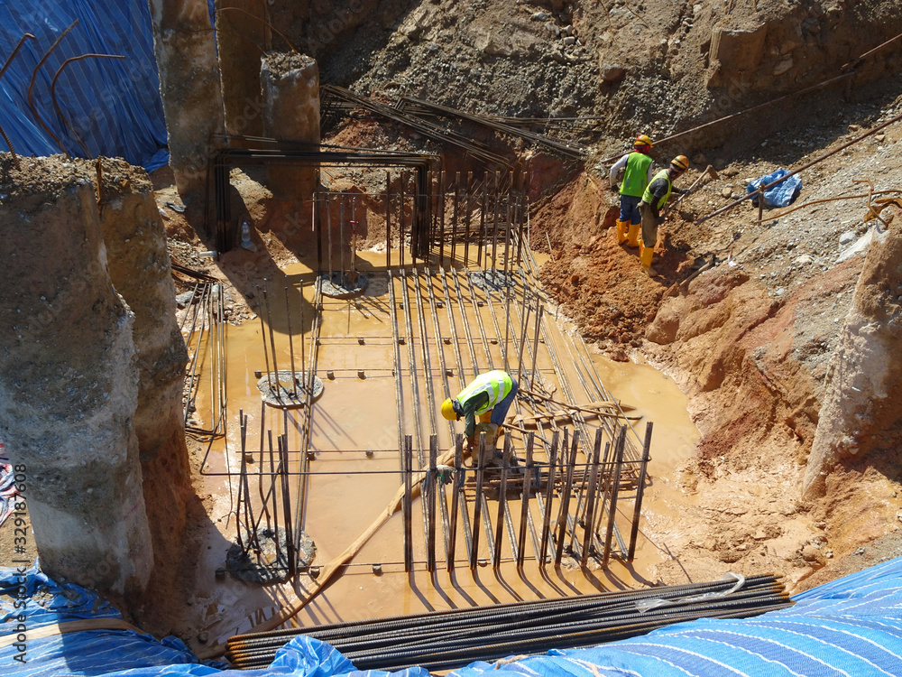 Pile cap and column stump under construction at the construction site ...