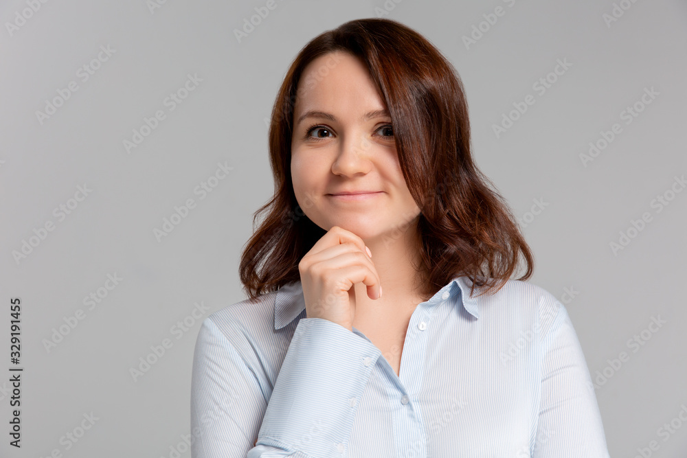Portrait of beautiful casually dressed young Caucasian woman having ...