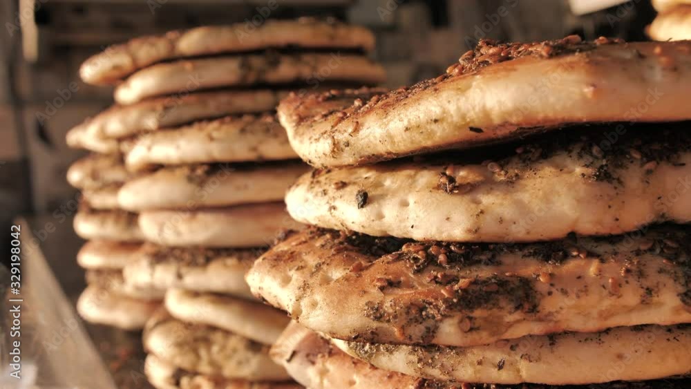 Stockvideon Freashly baked arab flatbreads at Mahane Yehuda Market in ...