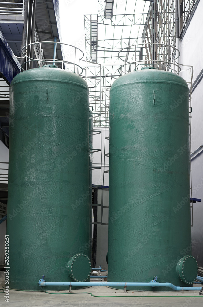 Giant industrial gas tanks with gas-pipelines placed on the safe zone ...