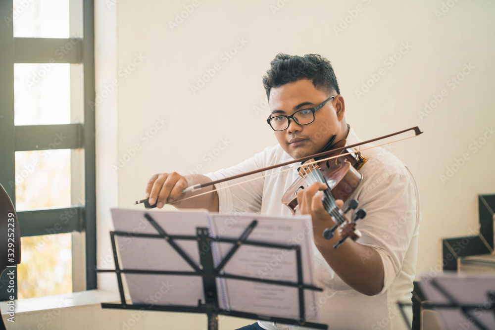 Symphony orchestra on outdoor background, hands playing violin. Male ...