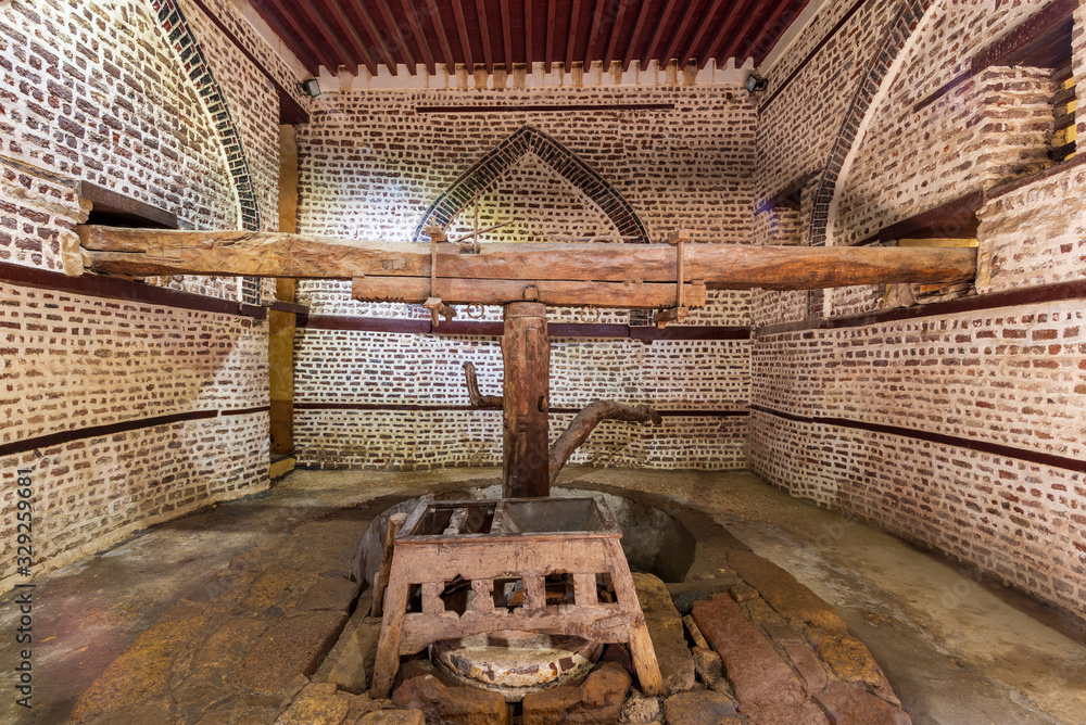 Front view of ancient rotary Flour Mill used to be rotated by animal ...
